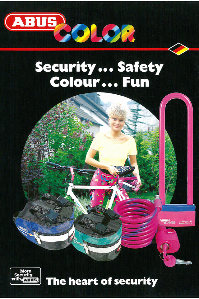A black poster with a circle in the centre showing a woman with a bicycle and a U-lock, a cable ...